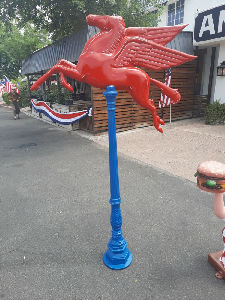 #M112 - Cast aluminum mobile pegasus Pole sign | MAG Auctions