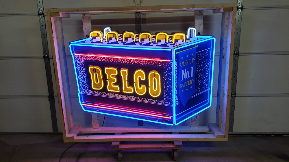 #M015 - Delco Animated Tin Neon Sign 60" x 45" | MAG Auctions