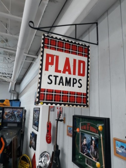 #Z027 - Plaid Stamps Metal Sign with Bracket | MAG Auctions